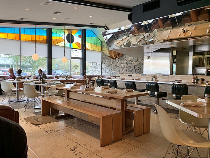 Sunlight streams through stained glass windows, casting colorful shadows across wooden tables where memories are made one meal at a time.