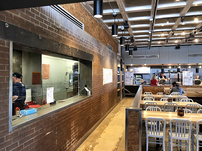 The open kitchen layout &ndash; barbecue theater at its finest. Watch the choreographed dance of slicing, weighing, and serving with mesmerizing precision.