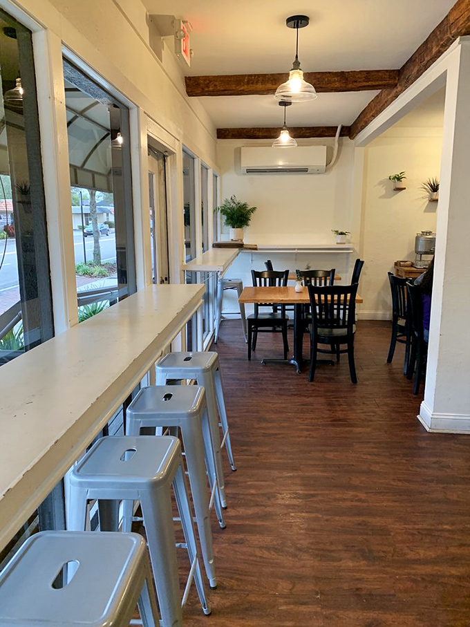 Window-side seating offers prime real estate for watching Winter Park life unfold while savoring exceptional breakfast treats.