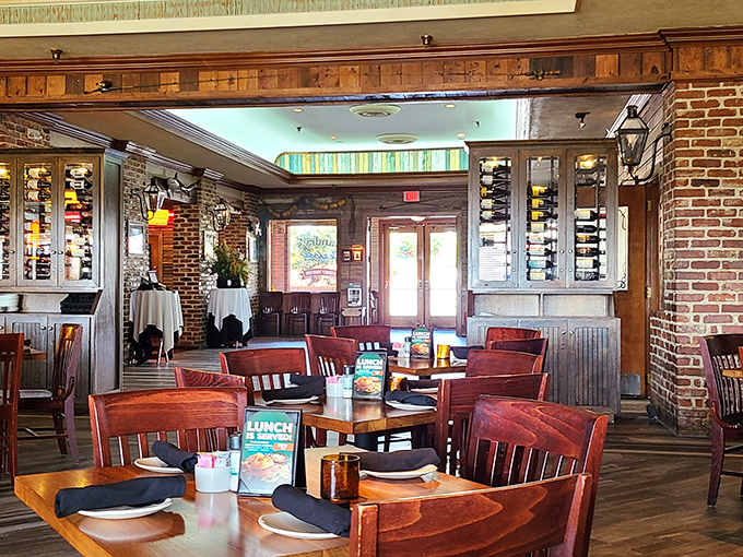 The dining room whispers "stay awhile" with its exposed brick, warm lighting, and an atmosphere that balances casual comfort with subtle elegance.