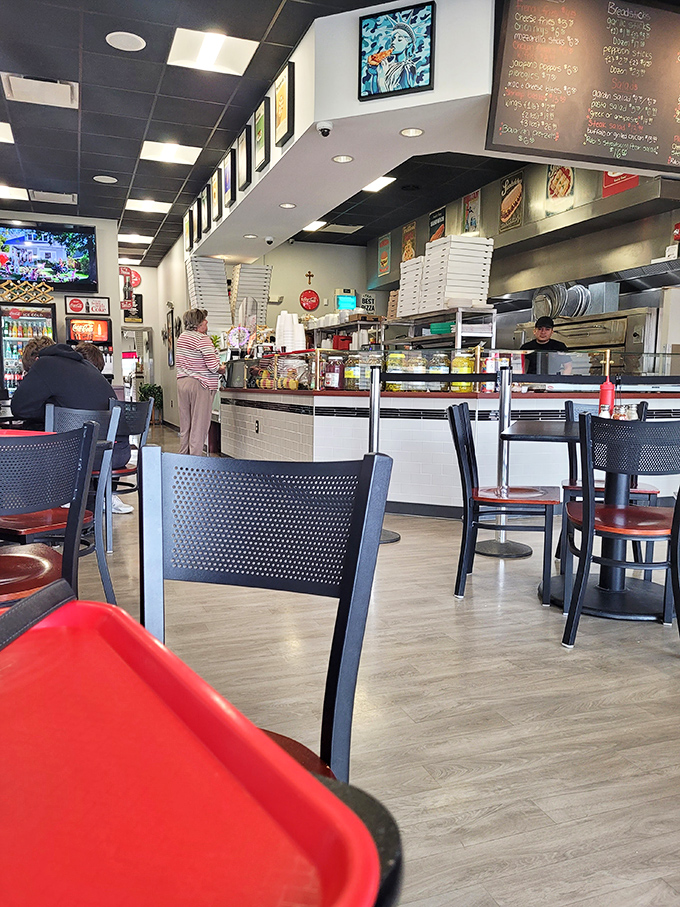 The counter service setup isn't just efficient&mdash;it's the stage where pizza dreams come true. Those menu boards aren't just lists&mdash;they're promises.