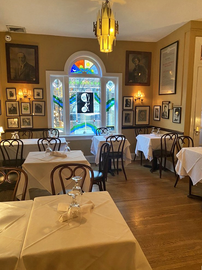 Stained glass and golden light create a dining alcove that feels like you've discovered a secret room in an Italian villa.