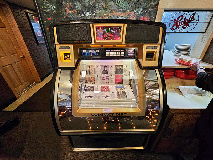 The vintage jukebox stands as a time machine in the corner, ready to transport diners back to simpler days with the press of a button.