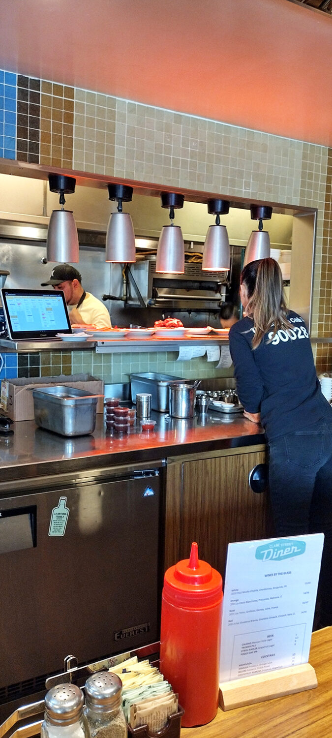 The kitchen pass &ndash; where culinary dreams become reality and servers transform into plate-balancing Olympic athletes during the breakfast rush.