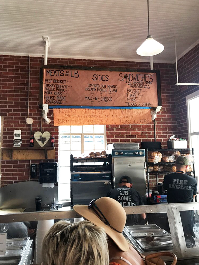 Where barbecue magic happens&mdash;simple tools, brick walls, and the confidence that comes from doing one thing perfectly.