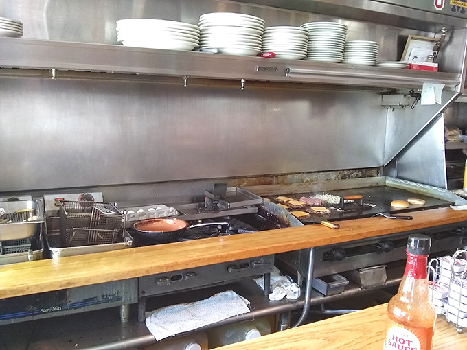 The kitchen battlefield where breakfast dreams come true&mdash;simple, efficient, and with that bottle of hot sauce standing ready for duty.