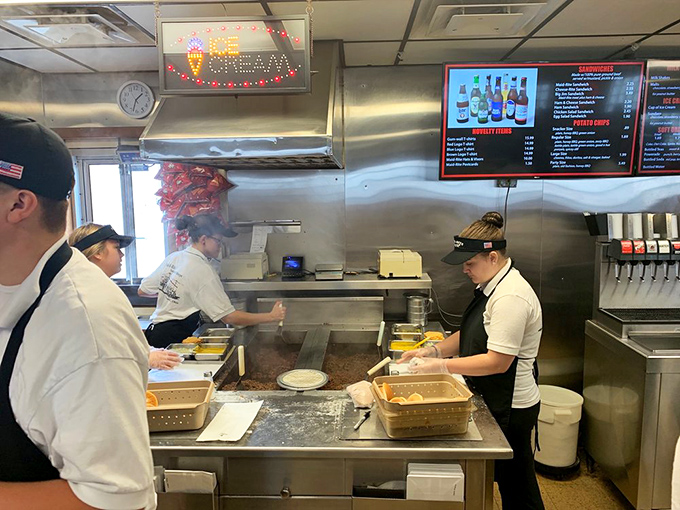 Behind the scenes where the magic happens – no molecular gastronomy, just hands that know exactly what they're doing.