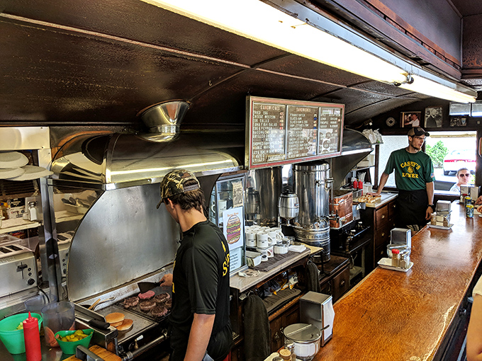 The kitchen choreography is mesmerizing&mdash;staff navigating the narrow space with the precision of submarine operators during a deep dive.