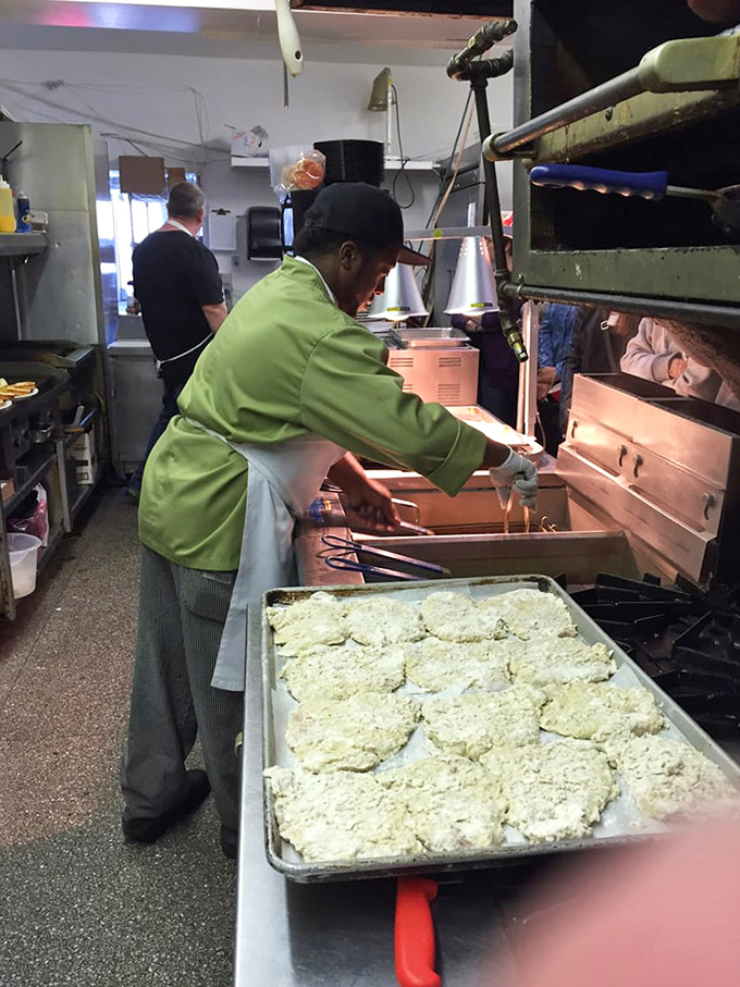 Kitchen choreography in action. Where the magic happens&mdash;skilled hands transforming simple ingredients into memories on a plate.