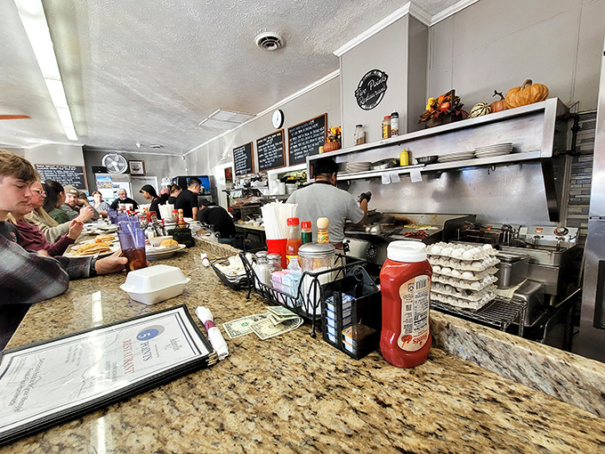 The open kitchen&mdash;where breakfast symphonies are composed in real-time. Mozart had his orchestra; Five Points has spatulas and sizzling griddles.