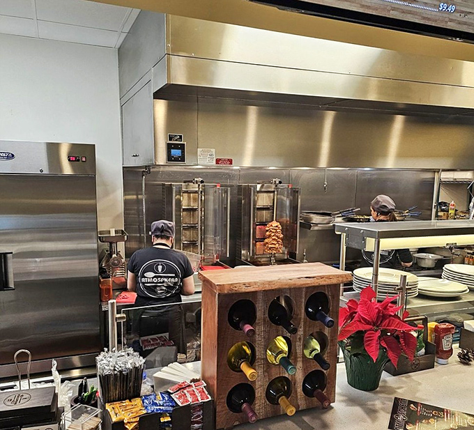 Where the magic happens! That vertical rotisserie is like a hypnotic meat lullaby, slowly turning dreams into delicious reality.