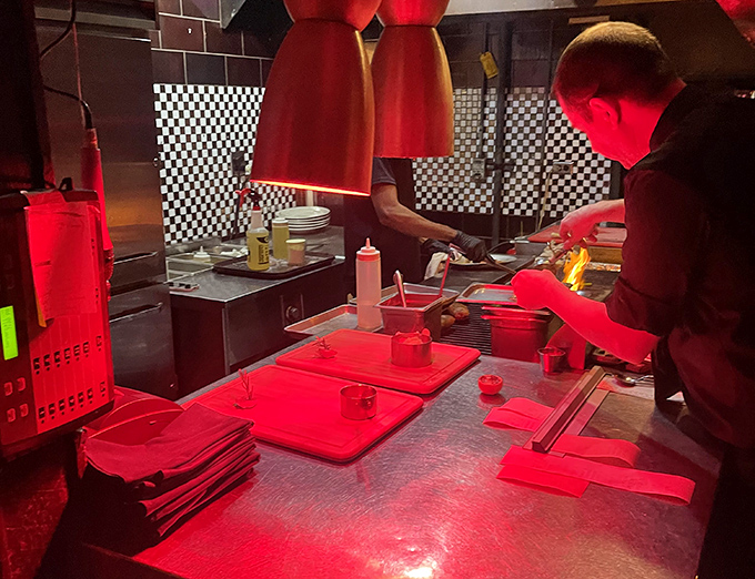 Behind the scenes, the kitchen glows red with the serious business of creating carnivorous masterpieces for hungry patrons.