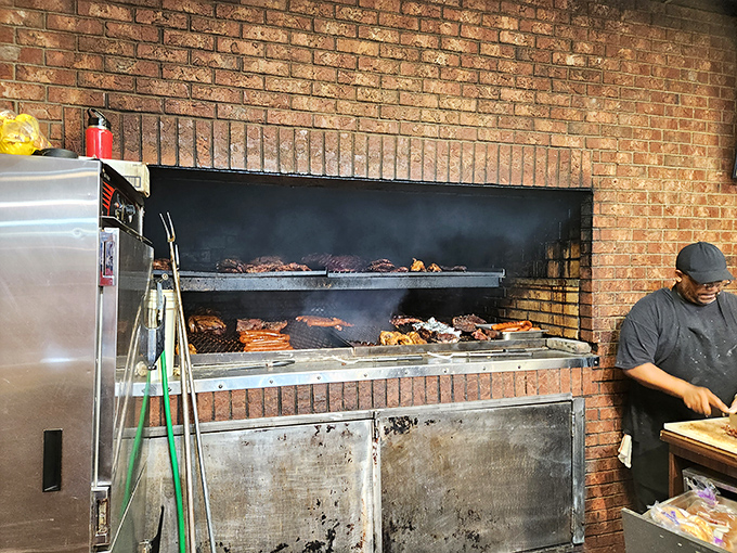 The brick-framed smoker works its magic, transforming ordinary meat into something that borders on the spiritual.