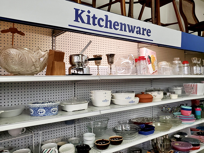 The kitchenware section: where vintage Pyrex and forgotten utensils find new purpose. That blue cornflower casserole dish has hosted countless family dinners.