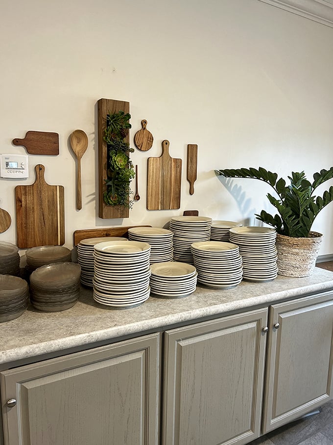 Rustic wooden cutting boards and stacked plates await their moment. Simple tools for extraordinary meals&mdash;the Amish way.