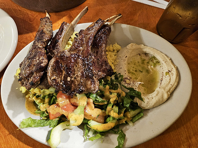 These lamb chops aren't just dinner&mdash;they're edible exclamation points, perfectly charred and resting on a bed of vegetables that refuse to be mere sidekicks.