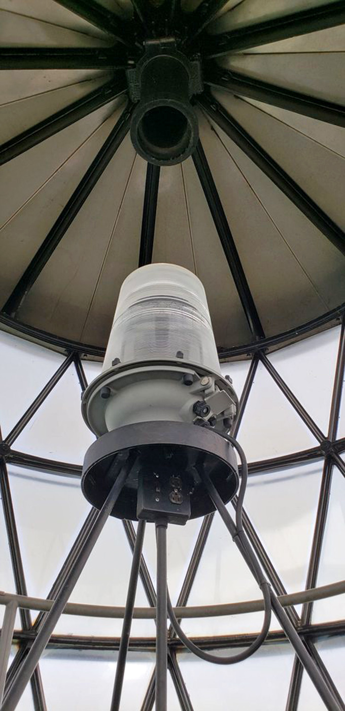 Looking up at the lighthouse lamp is like staring at the mechanical heart of maritime safety&mdash;both beautiful and purposeful.