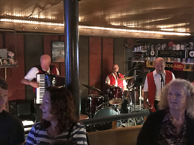Live music transforms dinner into an event. These musicians aren't background noise&mdash;they're the soundtrack to your schnitzel experience.