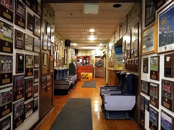 Walking through this memorabilia-lined corridor feels like strolling through aviation history—a perfect prelude to the culinary journey awaiting at the end of the runway.