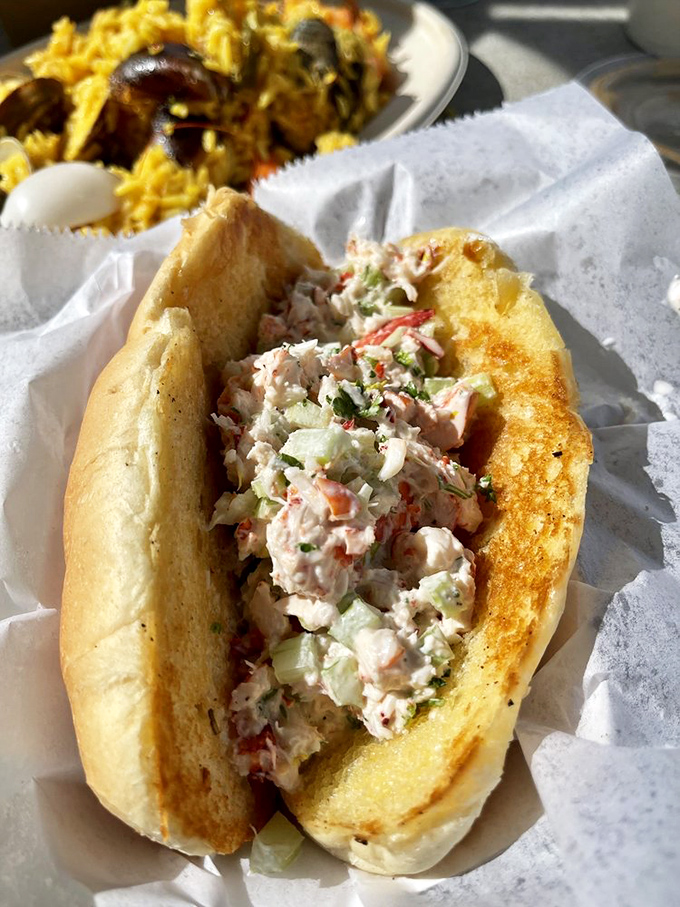 A lobster roll that's basically summer vacation in sandwich form. Buttery, toasted perfection cradling the ocean's most prized resident.