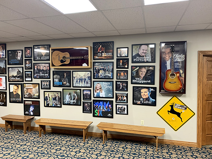 The theater wall showcases performers who've graced the Blue Gate stage, where entertainment comes with a side of wholesome.