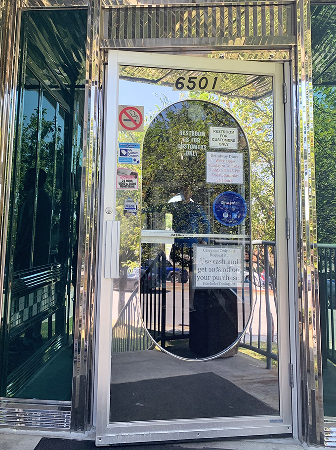 The entrance welcomes you through gleaming doors that promise culinary adventures await just steps beyond this threshold.