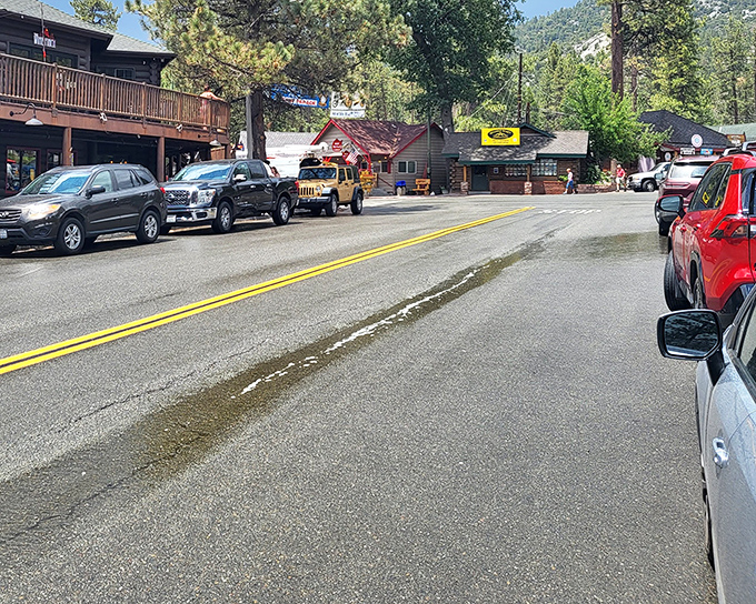 Main Street stretches before you like an invitation to wander. Those wooden buildings have witnessed decades of mountain stories.