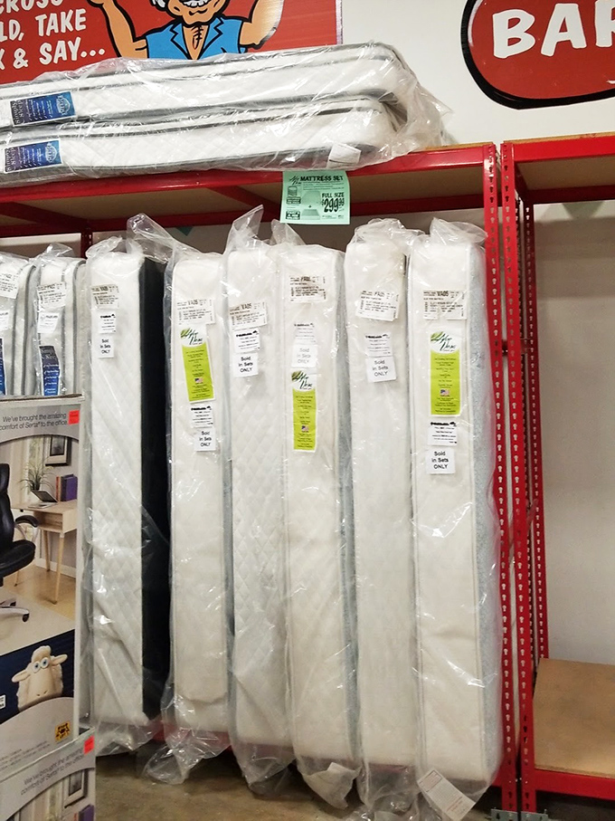 Mattresses lined up like sleeping sentinels. At these prices, counting sheep becomes counting the money you saved instead.