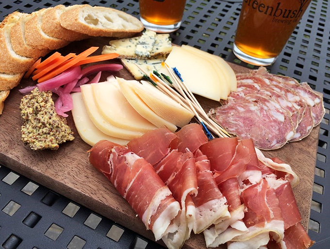 A charcuterie board that turns strangers into friends. Those pickled vegetables aren't just garnishes&mdash;they're palate cleansers between bites of smoky, salty perfection.
