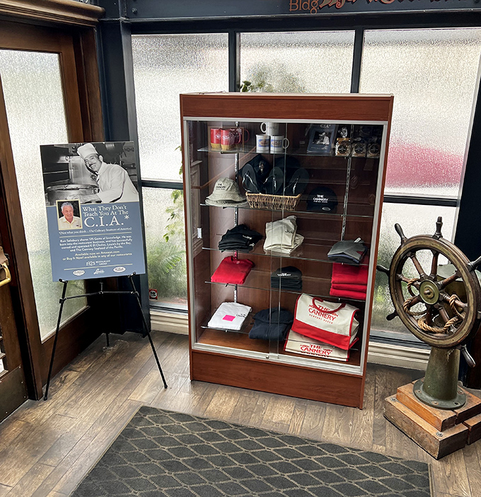 Maritime memorabilia that tells stories without saying a word - a ship's wheel and branded merchandise nodding to The Cannery's nautical roots.