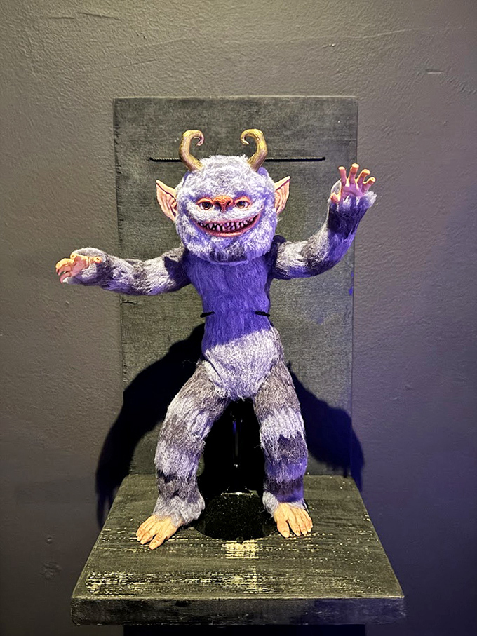 Part folklore, part nightmare fuel, this purple creature with its mischievous grin seems eager to grant wishes with catastrophically ironic consequences you didn't think to specify.