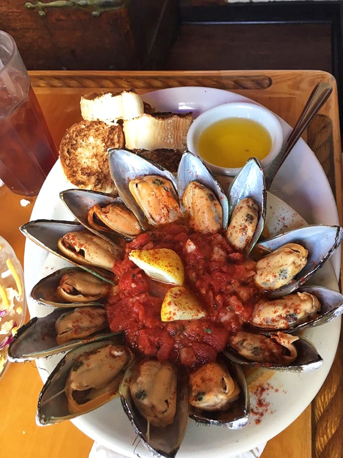 These mussels aren't just opened&mdash;they're practically performing a synchronized swimming routine in that spicy tomato bath.