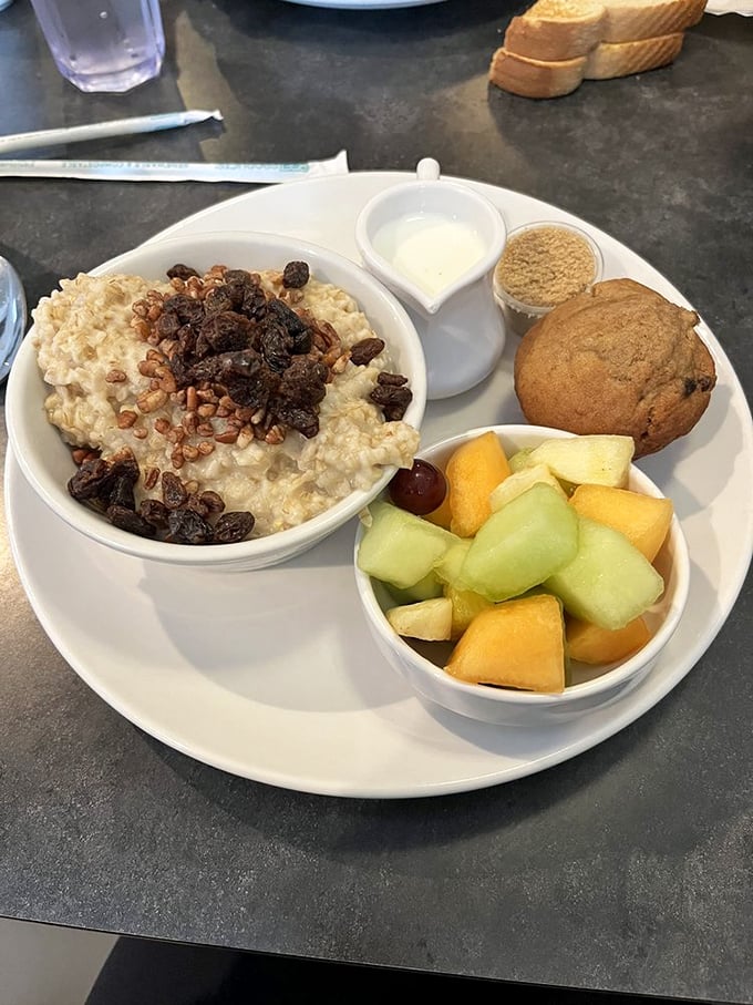 Oatmeal elevated from humble breakfast to morning masterpiece, with fruit that didn't come from a can and a muffin that deserves its own fan club.