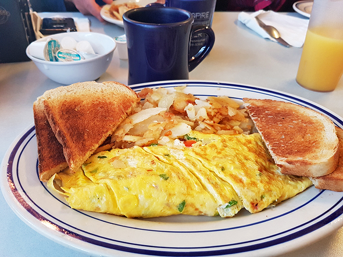 The Western omelet that launched a thousand satisfied sighs, flanked by toast soldiers ready for the breakfast battlefield.