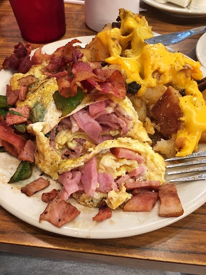 This isn't just an omelet&mdash;it's a protein-packed envelope delivering a love letter of ham, bacon, and melted cheese straight to your soul.
