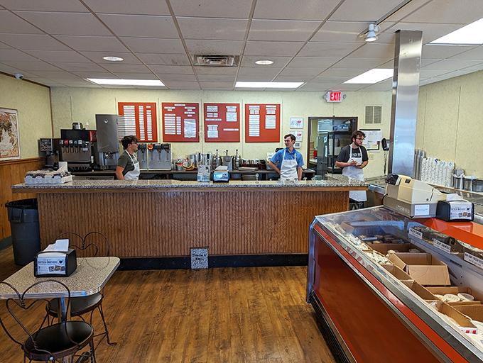 The counter where memories are made, one scoop at a time. These servers aren't just employees&mdash;they're happiness engineers in aprons. 