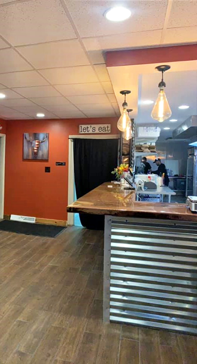 The counter where barbecue dreams come true, complete with Edison bulbs that cast a warm glow on what's about to be the highlight of your week.