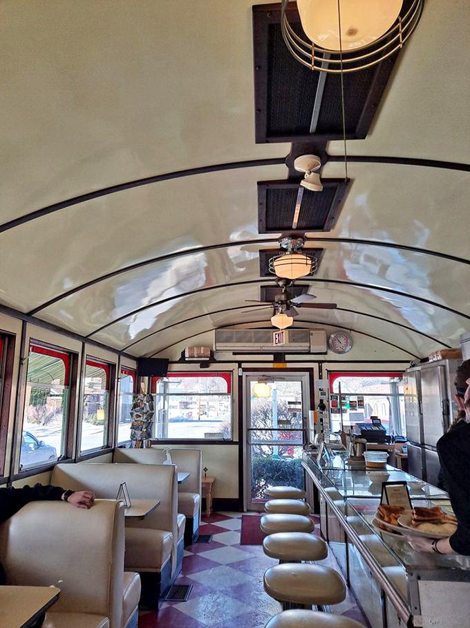 Another angle of diner perfection—where the curved ceiling, vintage lighting, and pristine counter create an atmosphere that Hollywood set designers try desperately to recreate.