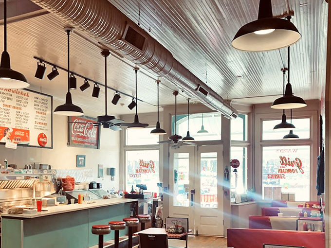 Sunlight streams through windows illuminating a diner space that feels both timeless and essential&mdash;where conversations flow as easily as the coffee.