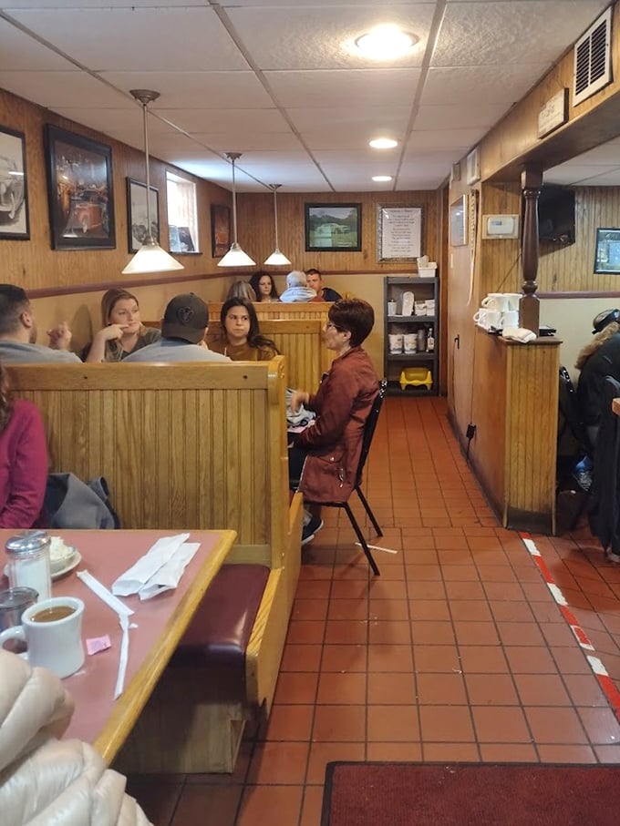 Wood-paneled warmth and booth seating create the perfect backdrop for conversations that flow as freely as the coffee refills.