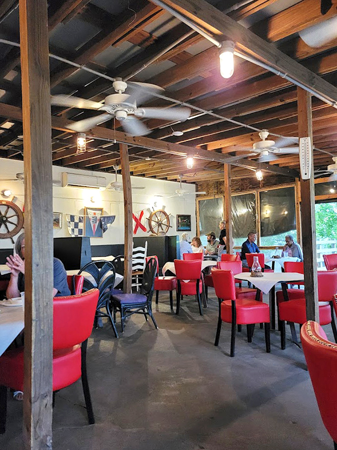 The dining room feels like the galley of a well-loved ship, where ceiling fans lazily spin and nautical flags remind you of your proximity to the water.
