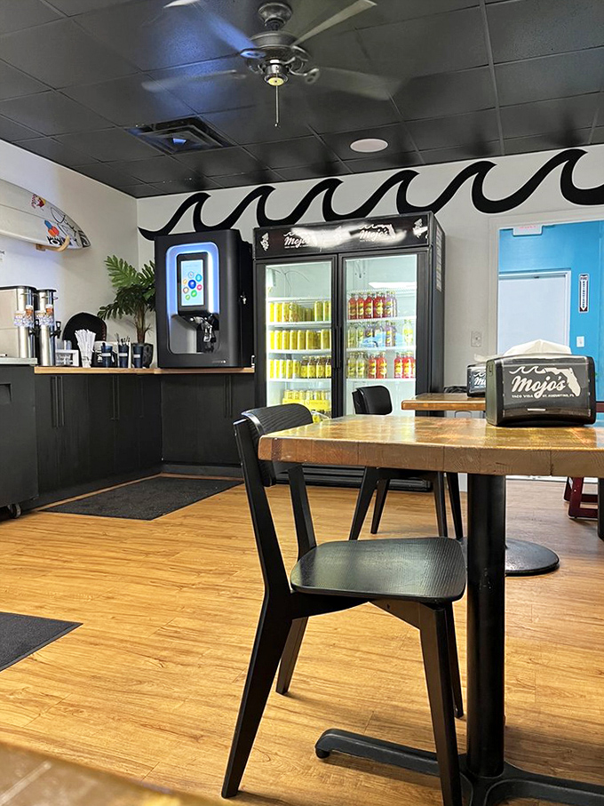 Modern meets coastal in this dining area. The wave design on the wall reminds you that the ocean is never far away in St. Augustine.