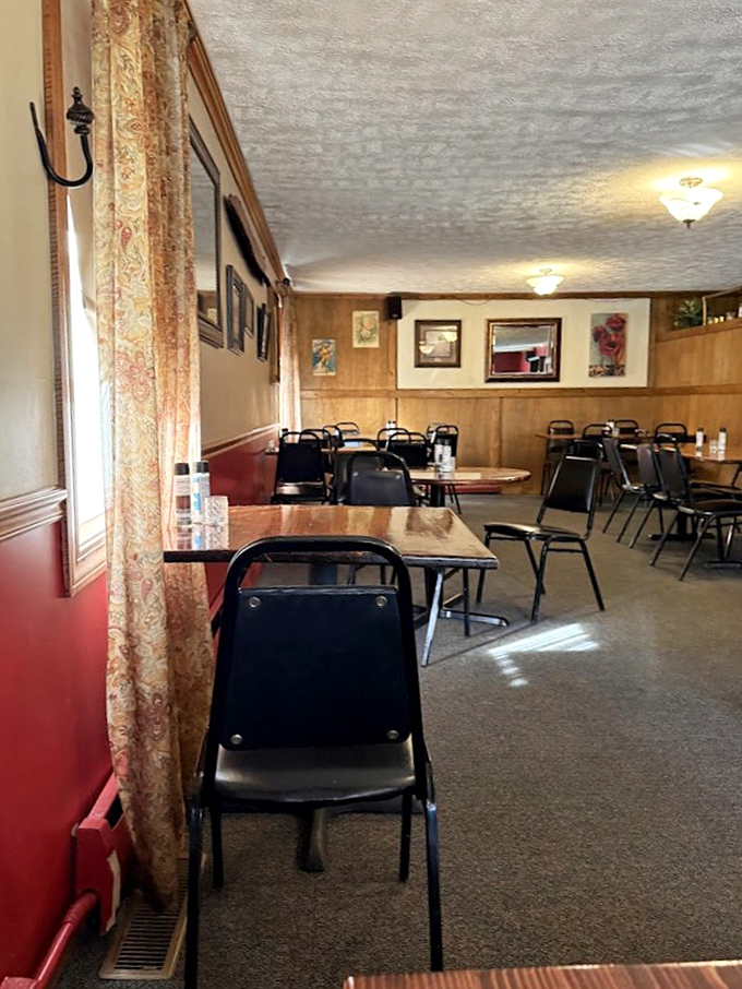 Wood paneling, patterned curtains, and comfortable chairs&mdash;not designed by an Instagram influencer, but by someone who understands real hospitality.