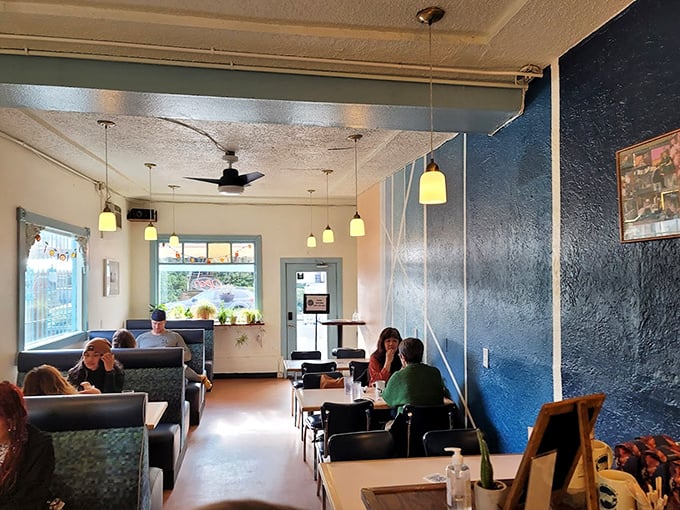The dining room's pendant lights cast that perfect golden glow where everyone looks like they're in a feel-good indie film about finding community.