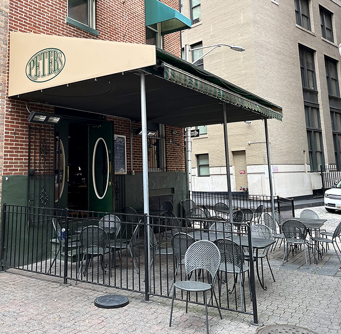 The outdoor seating area offers urban al fresco dining where the soundtrack is pure Baltimore&mdash;sirens, laughter, and the occasional heated sports debate.