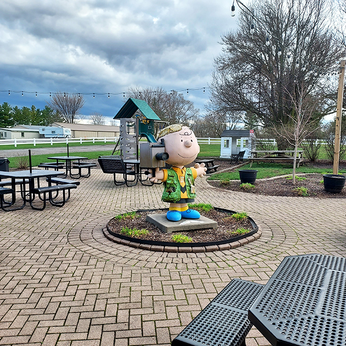 The outdoor seating area, complete with Charlie Brown statue, offers the perfect stage for the time-honored tradition of savoring summer one bite at a time.
