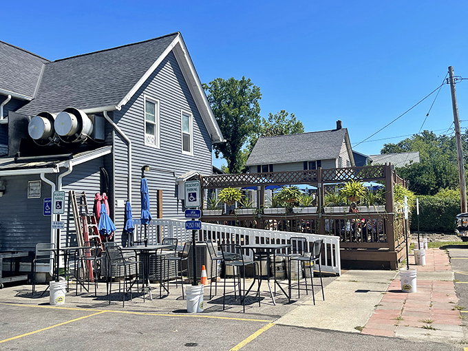 The outdoor patio beckons with promise of fresh air dining, where summer breezes complement every bite and Lake Erie feels just a little closer.