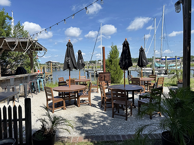 Waterfront dining without pretension &ndash; where umbrellas provide shade and the view reminds you exactly why seafood tastes better near the water.
