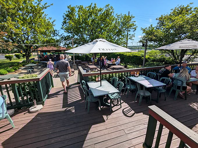 The back porch that gives the saloon its name—a sun-dappled wooden oasis where fresh air makes everything taste even better.