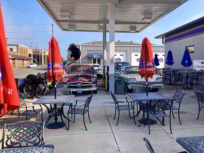 The outdoor seating area doubles as a classic car showcase&mdash;because nothing complements breakfast like vintage automotive eye candy.